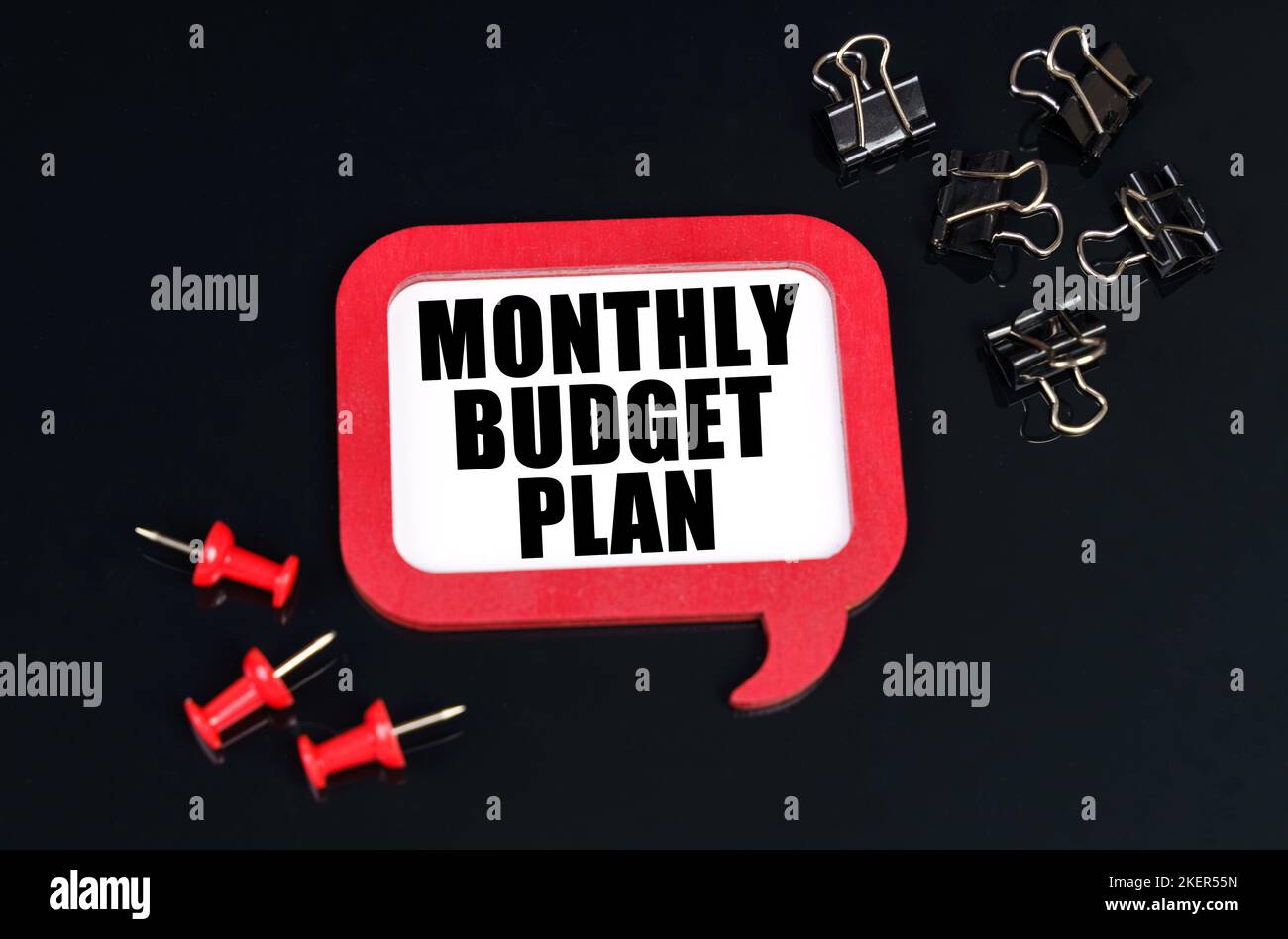 Economy and business concept. On a black surface, office supplies and a ...