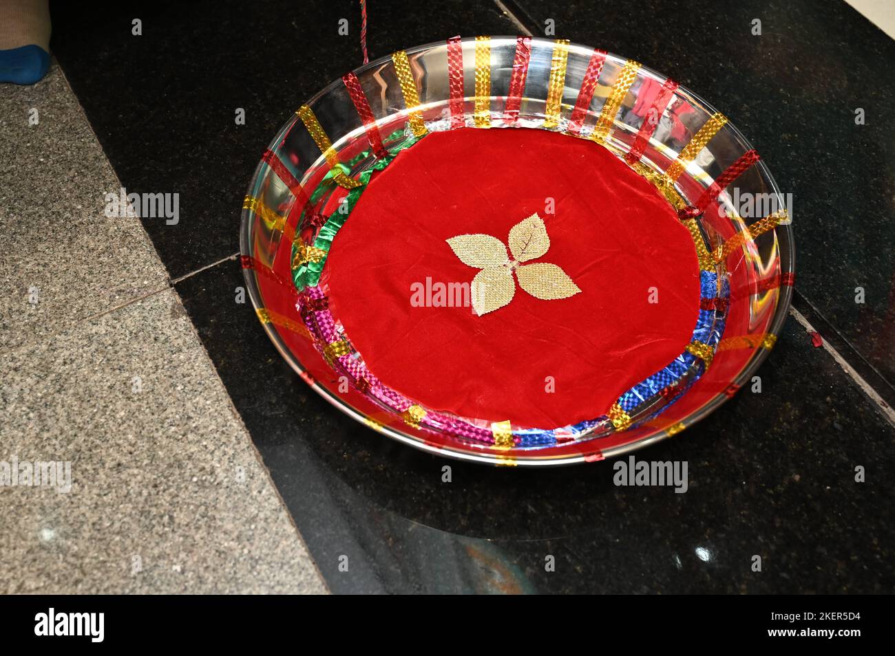 Beautifully Decorated Pooja Thali, having Indian sweet motichoor bundi ...