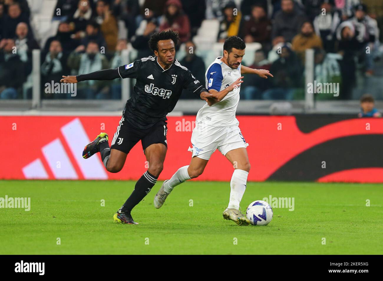 TURIN, ITALIY, 13 NOVEMBER, 2022. Pedro of SS Lazio and Juan Cuadrado ...