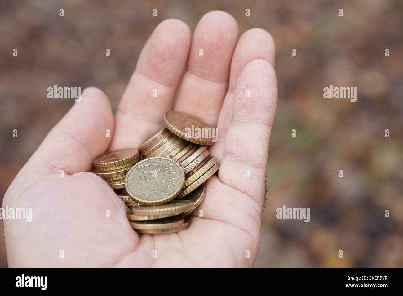 Handful of pound coins hi-res stock photography and images - Alamy