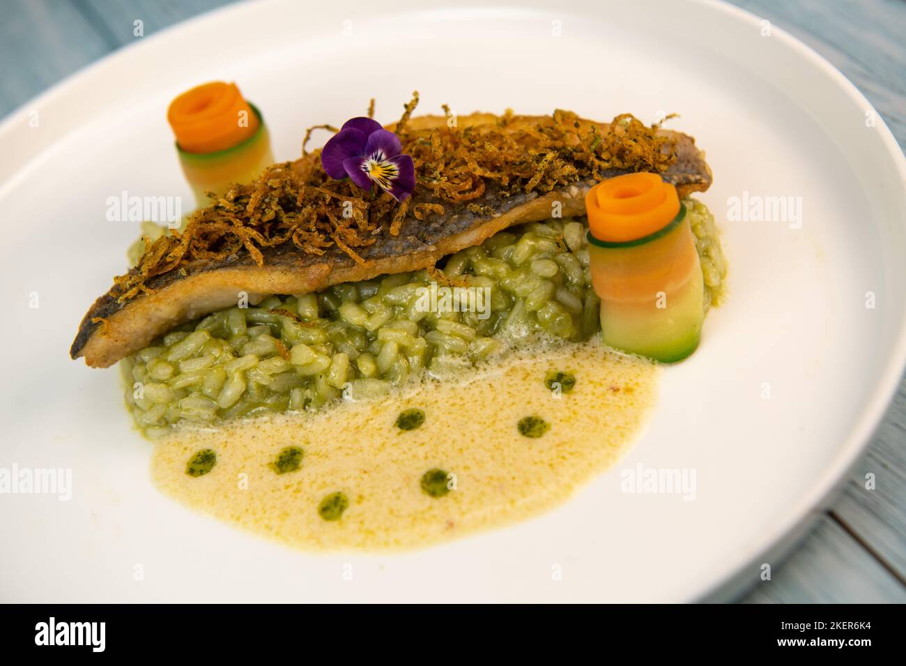 Recipe for fried fillet of sea bass with herb risotto, white wine sauce ...