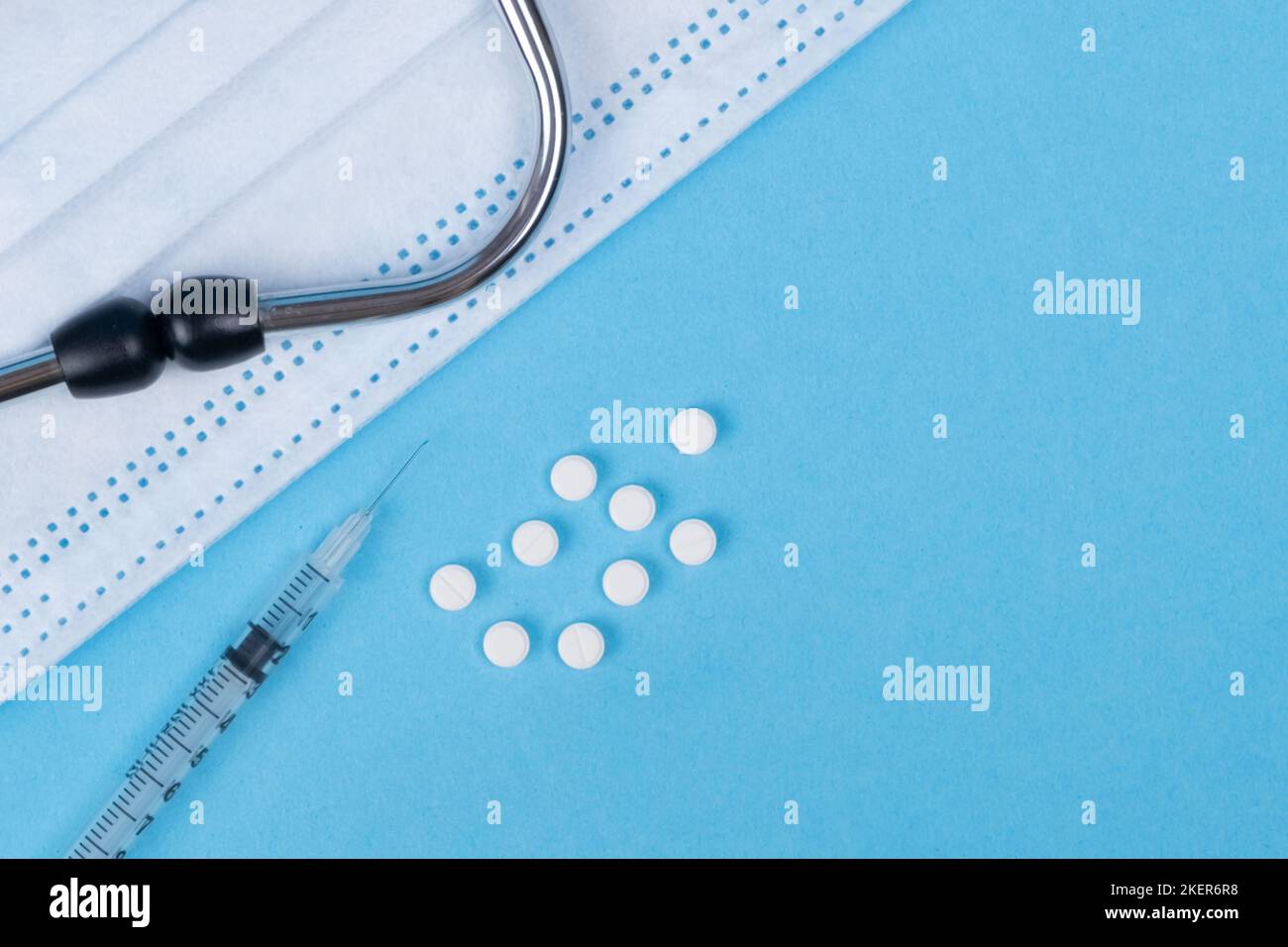 Medical supplies: mask, tablets, stethoscope, syringe isolated on a ...