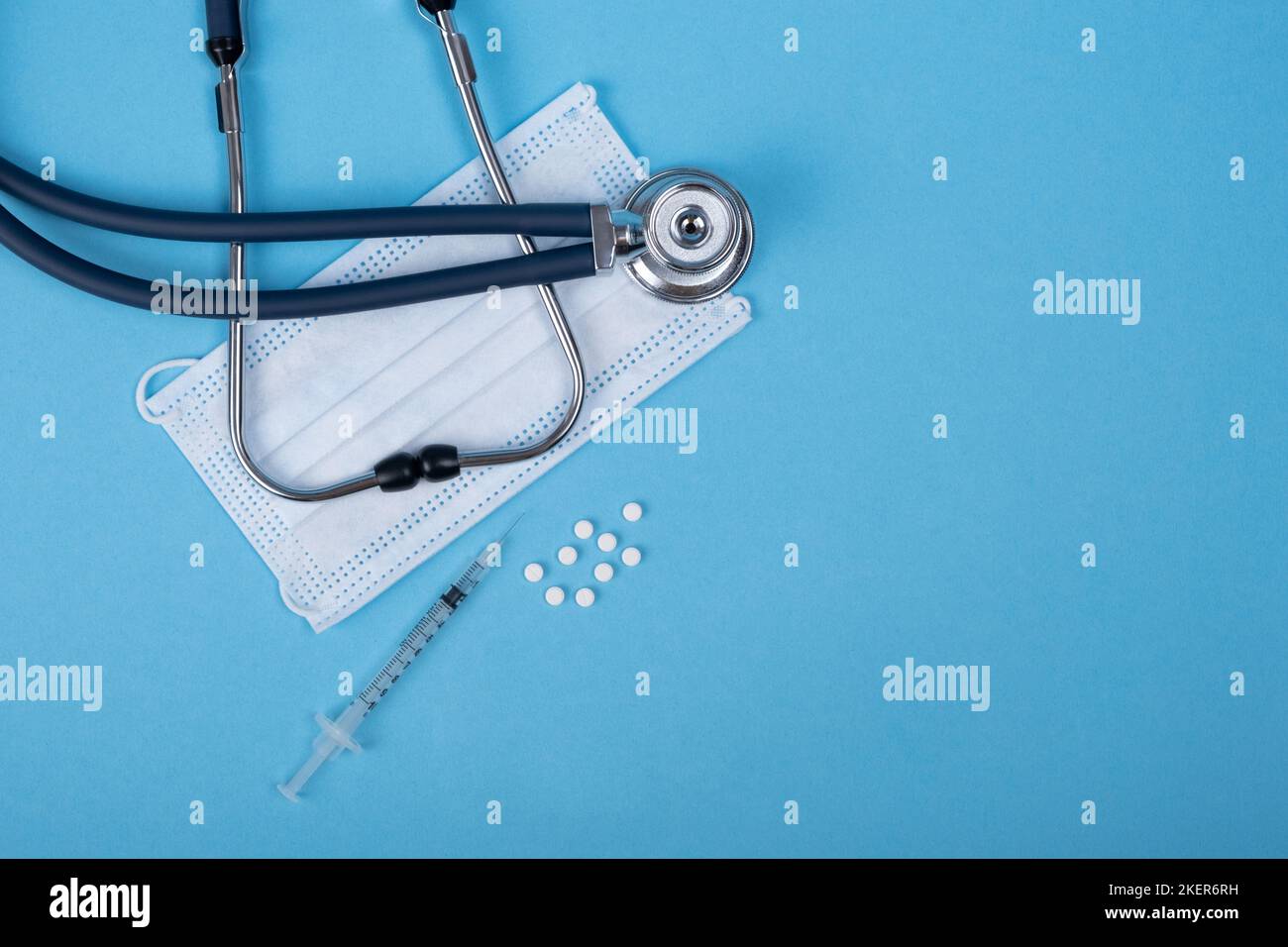 Medical supplies: mask, tablets, stethoscope, syringe isolated on a ...