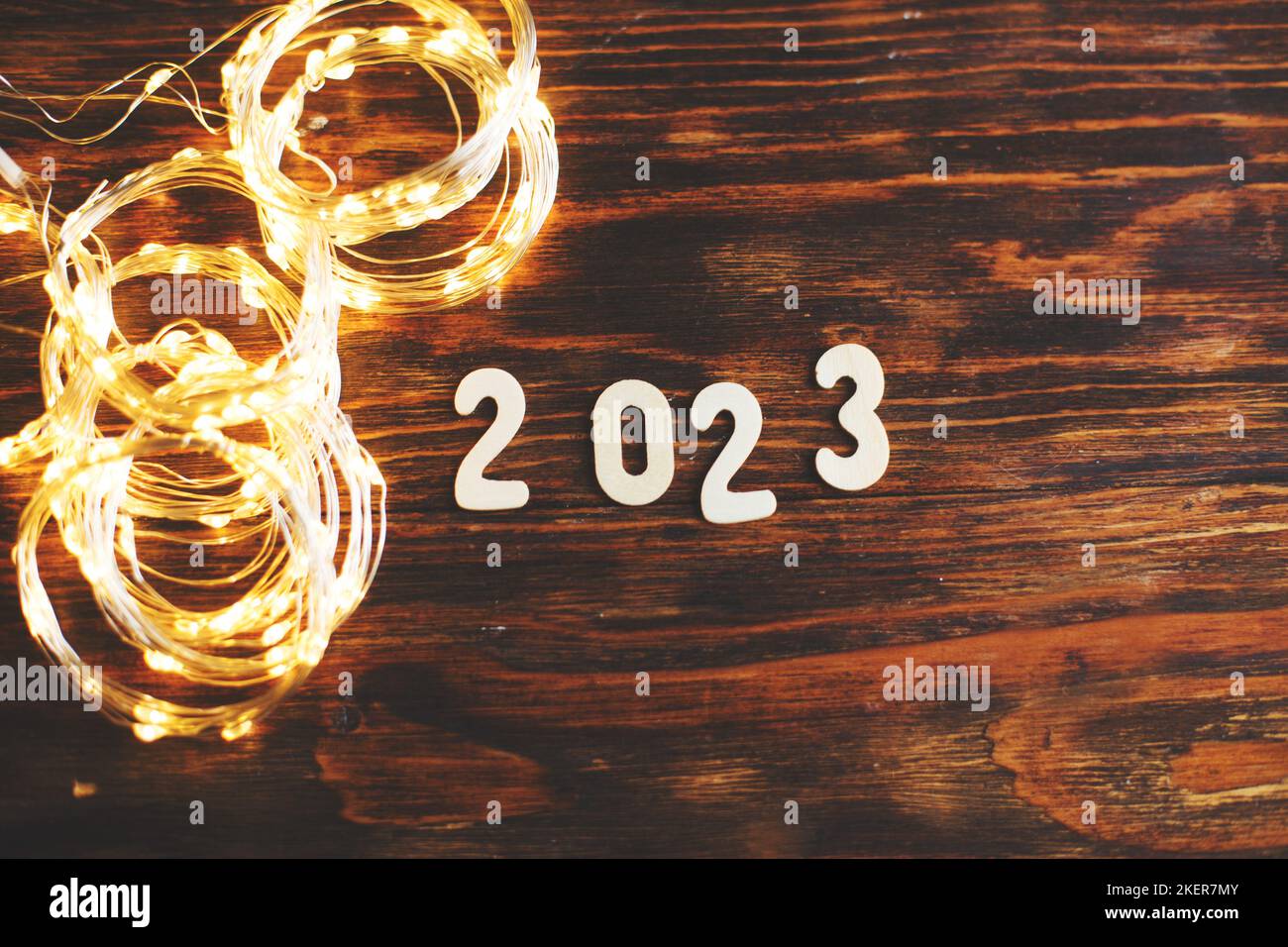wooden number 2023 on christmas shiny wooden background. with sparkle ...