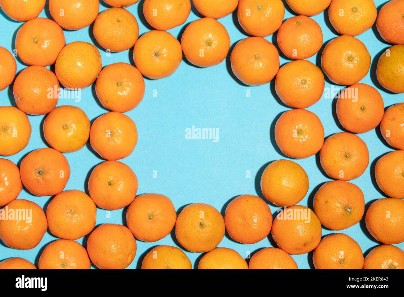 Juicy and natural tangerines texture with empty space in the middle ...