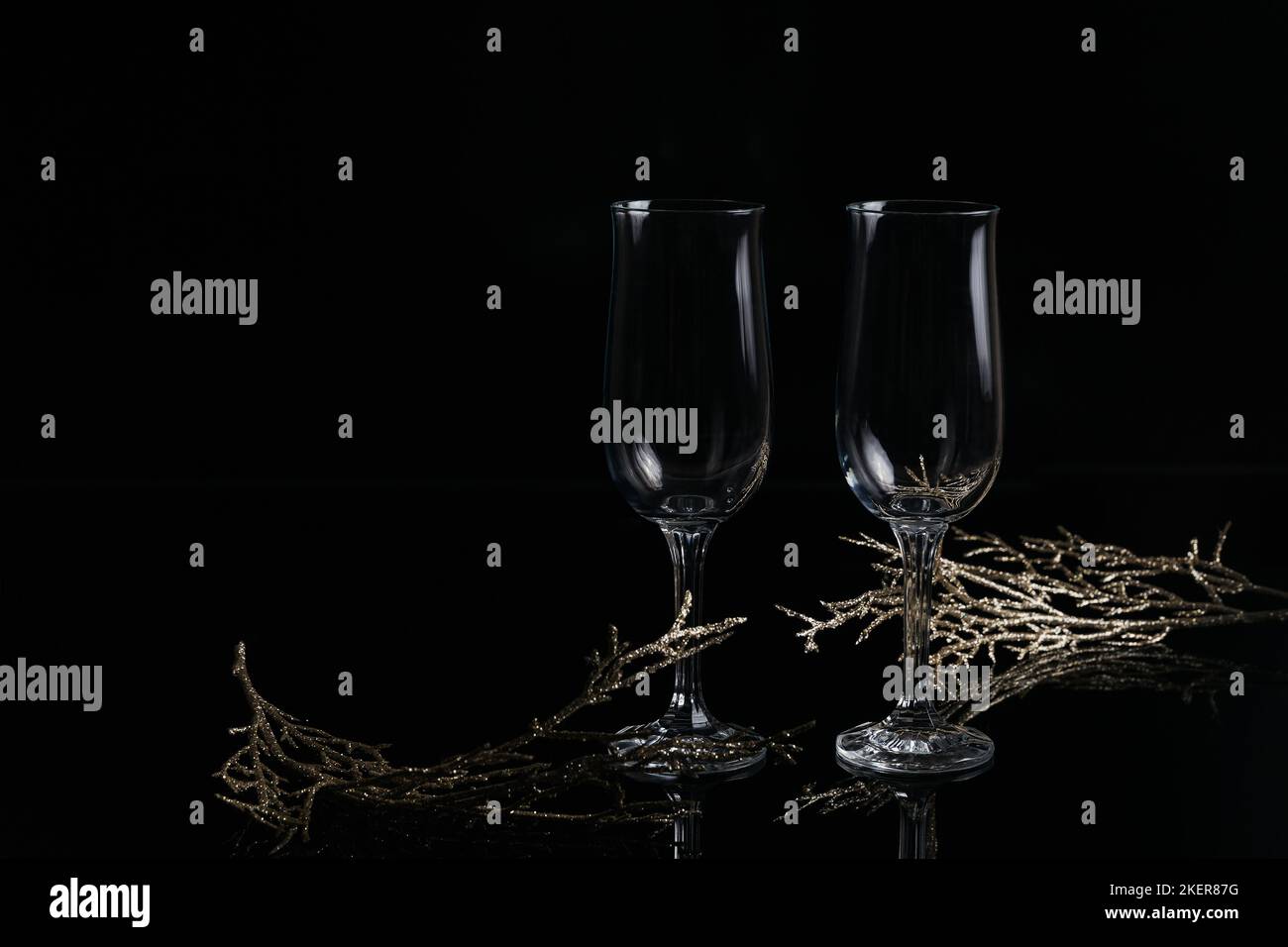 Two empty glasses of champagne and Christmas or New Year decoration on ...