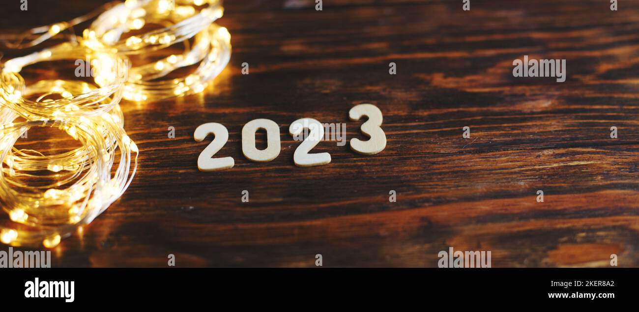wooden number 2023 on christmas shiny wooden background. with sparkle ...