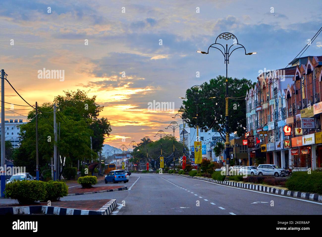 Sunset landscape avenue, in the city of Kuang on a tropical island in ...