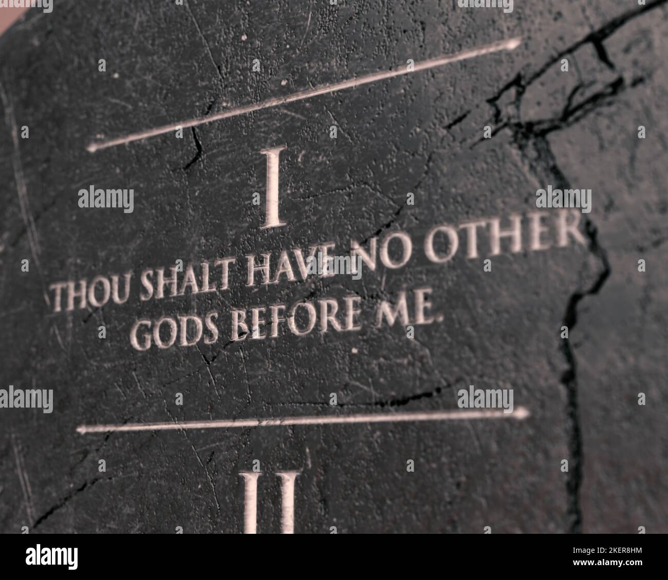 A view of the first commandment etched into a cracked stone tablet on ...