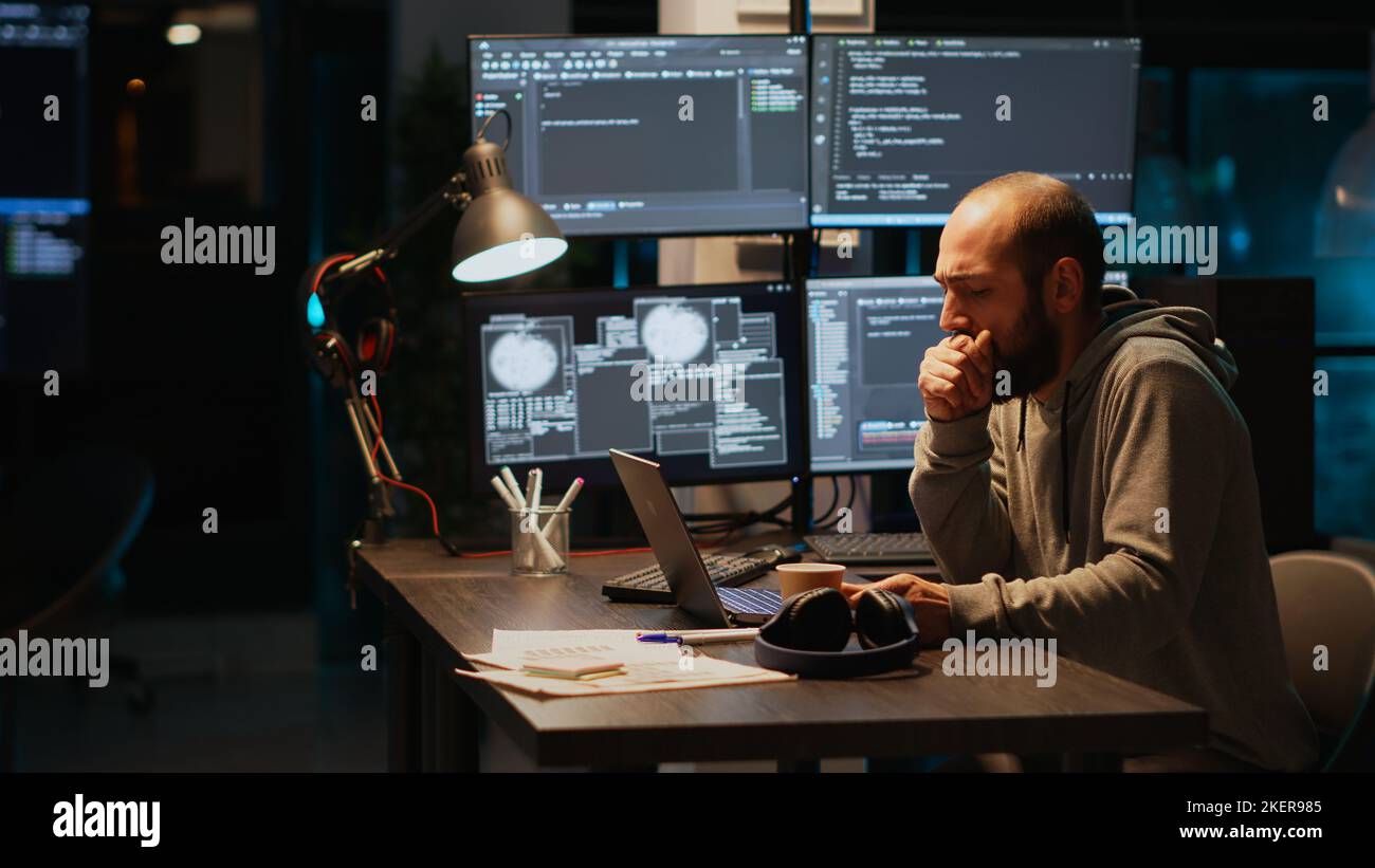 Sick programmer having sore throat and coughing in office, drinking cup ...