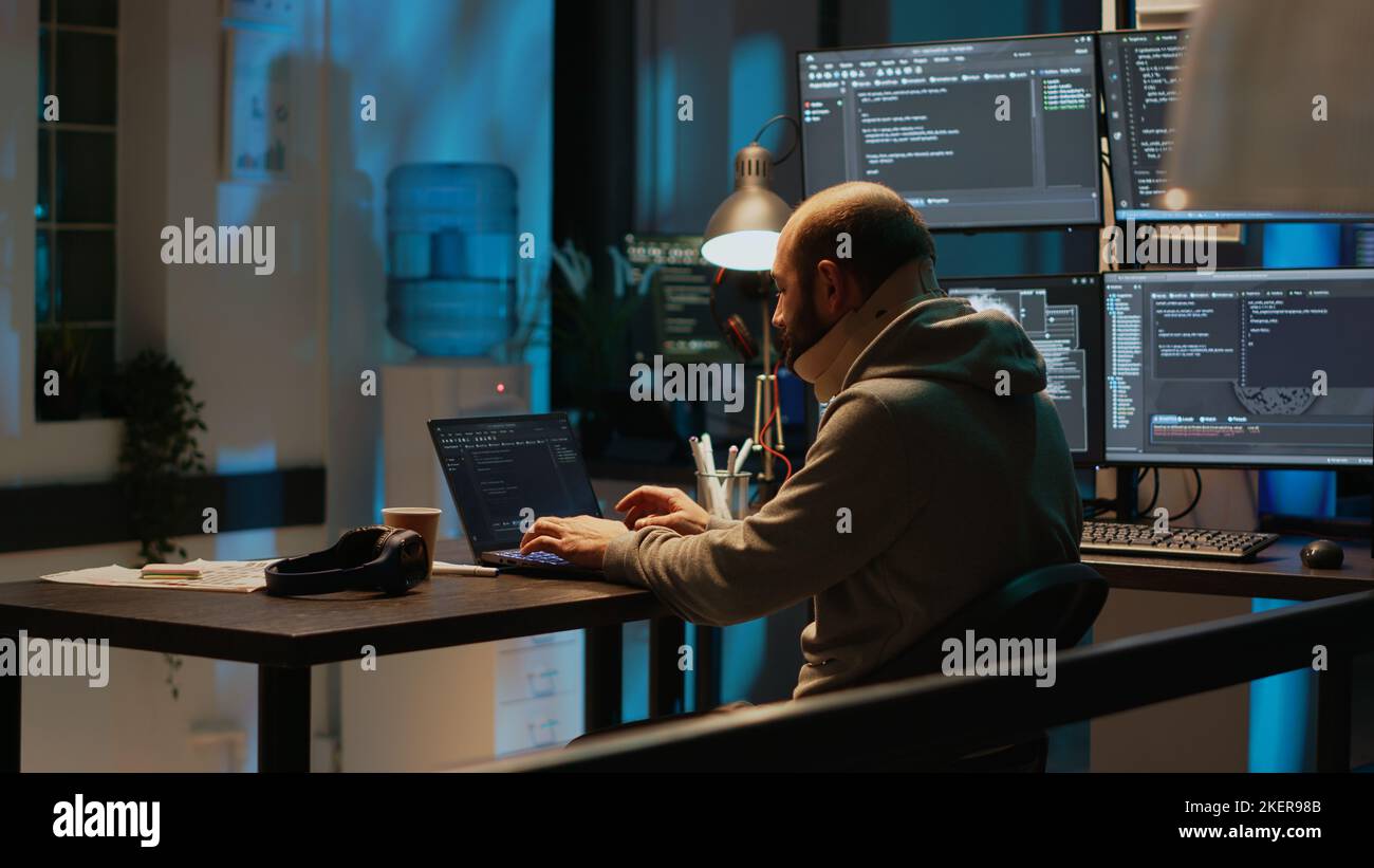 Database admin wearing cervical neck collar at web developing job ...