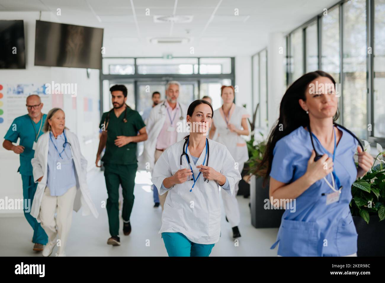 Young stressed doctors running at hospital corridor Stock Photo - Alamy