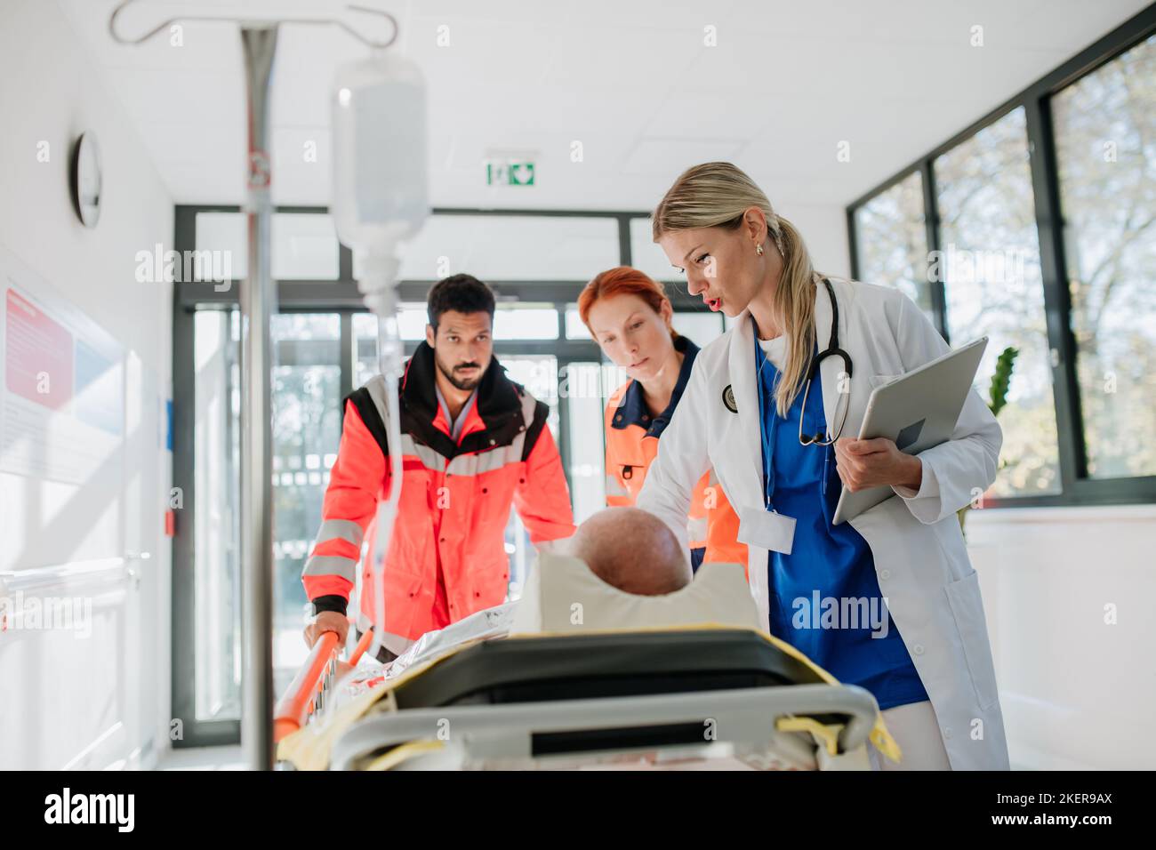 Young woman doctor taking care of patient from rescue ambulance Stock ...