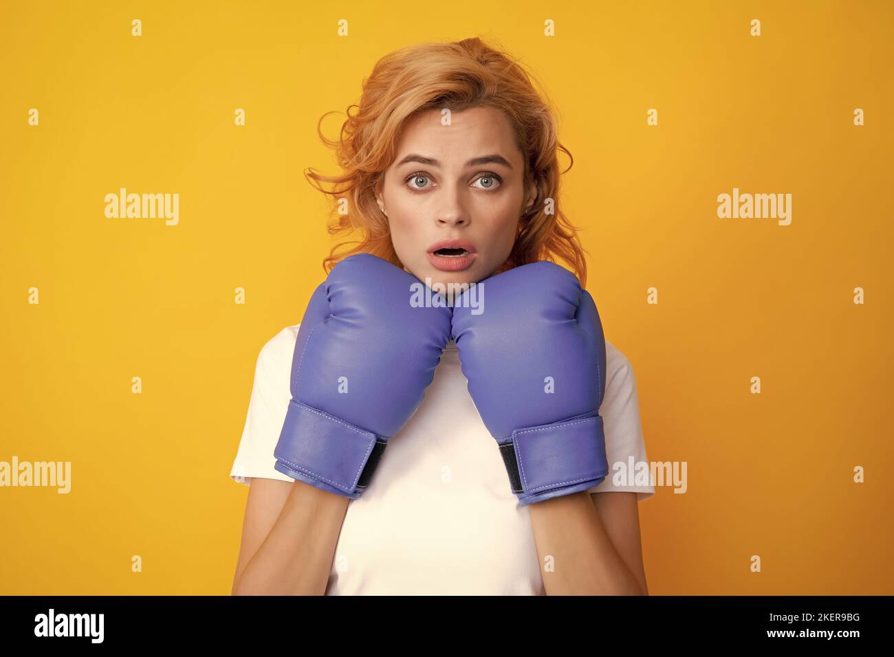 Woman in boxing gloves. Surprised female boxer Stock Photo - Alamy