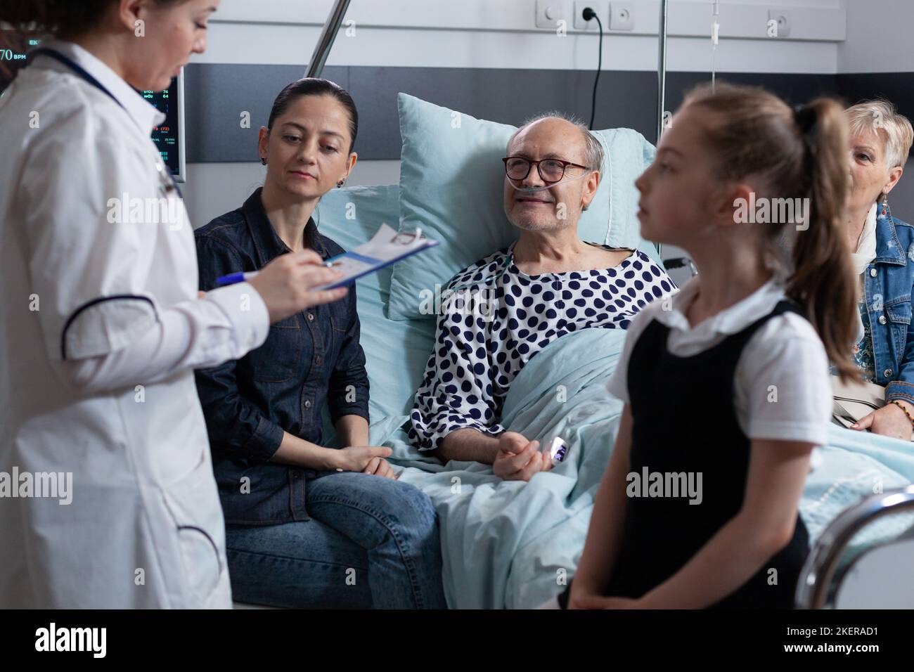 Medical professional performing vital signs check to sick elderly man ...