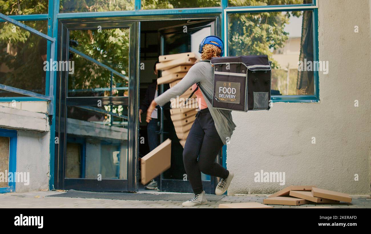 Female carrier dropping pizza packages, sad client crying after dropped ...