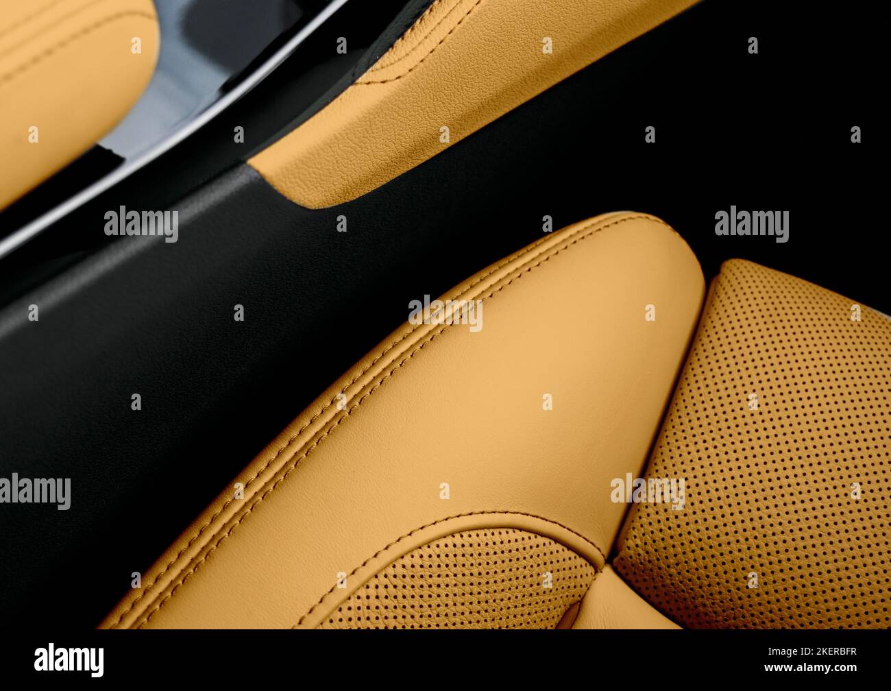 Modern luxury car brown leather interior. Part of perforated leather ...