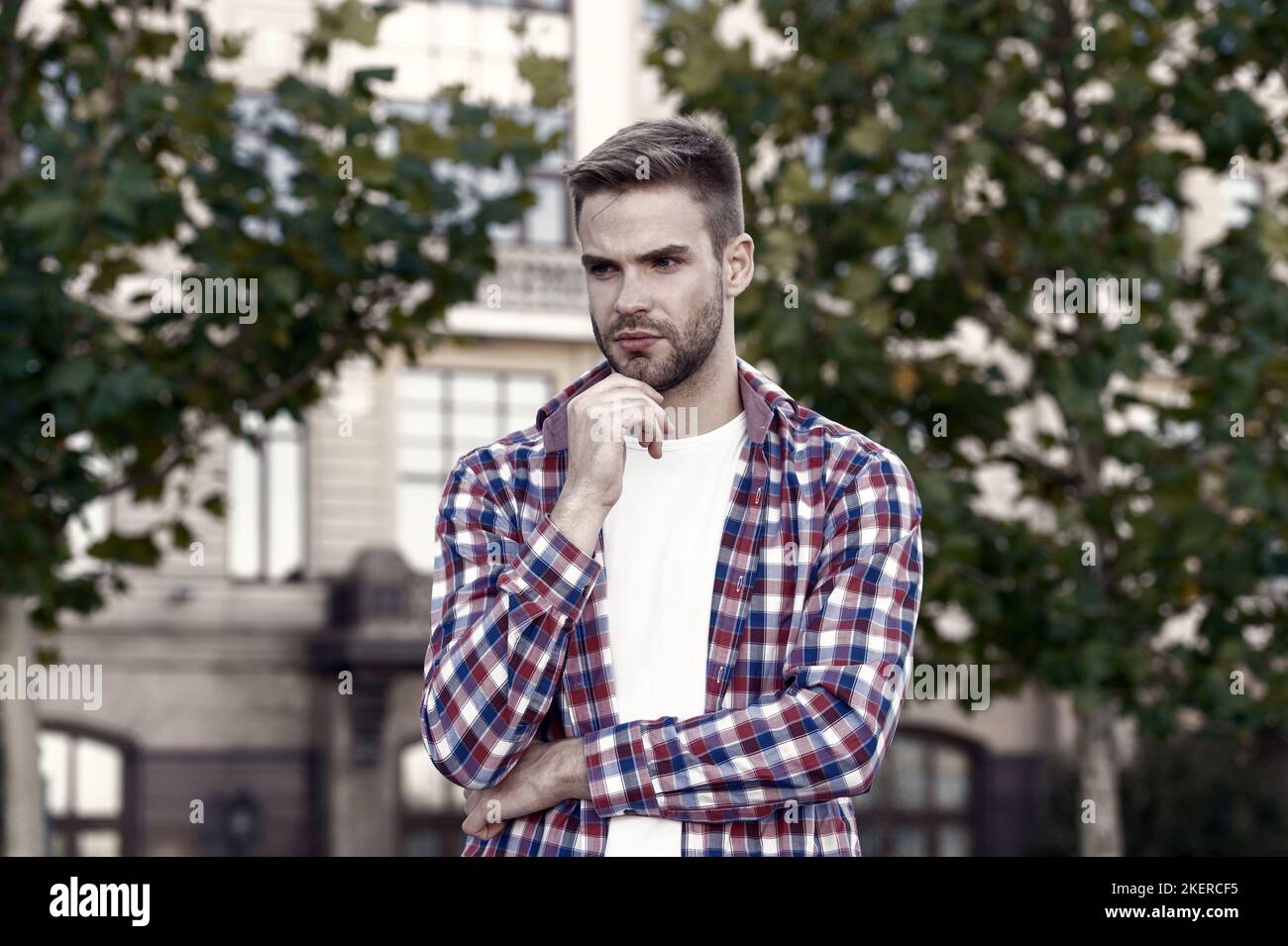 More attractive with beard. Serious man touch beard urban outdoor ...