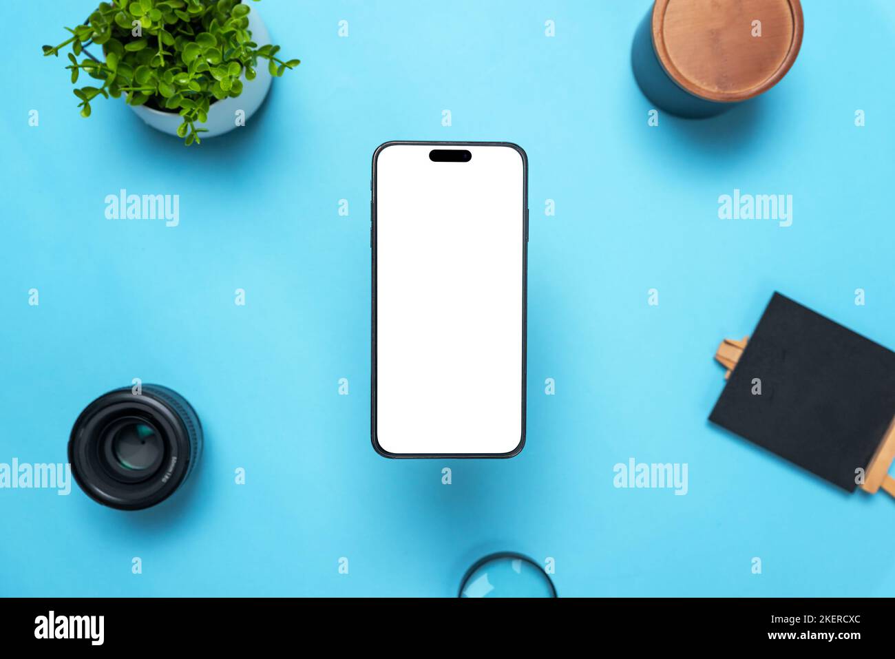Phone mockup above a desk with objects around. Levitation above top ...