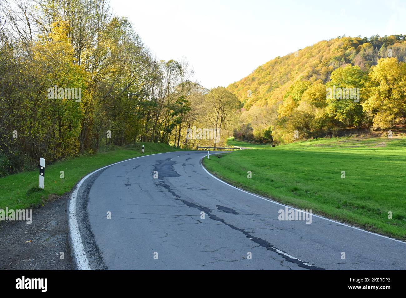 baldy repaired country road with cracks Stock Photo - Alamy