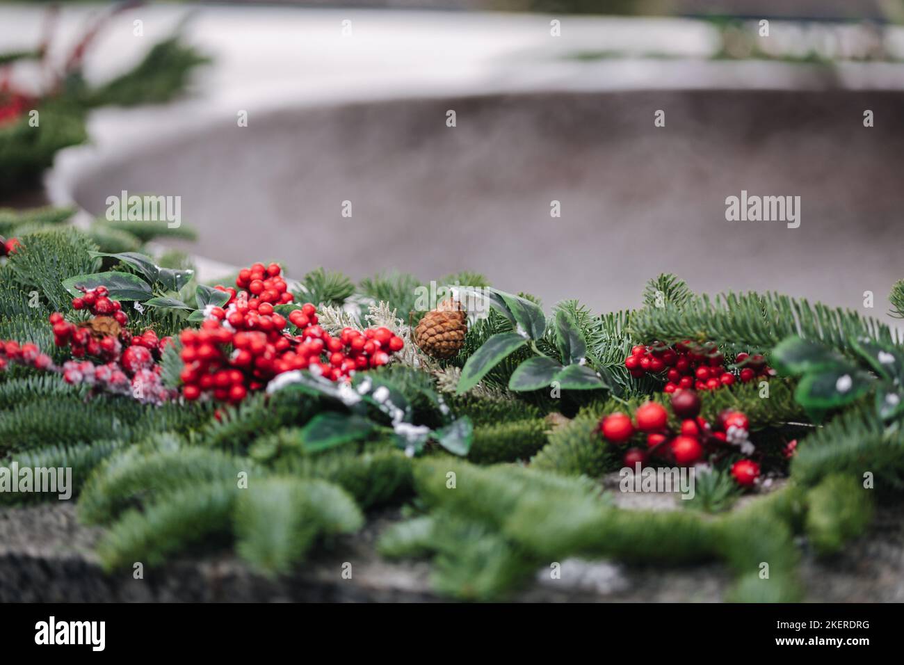 Hot tub with spa in winter with snow and decorated candles. Christmas ...