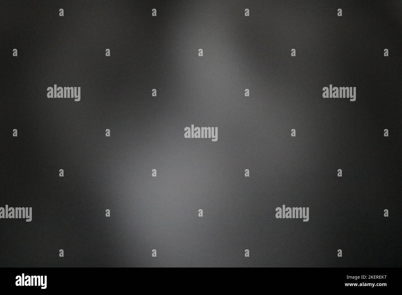 Blurred soft grey coloured mottled background with space for copy Stock ...