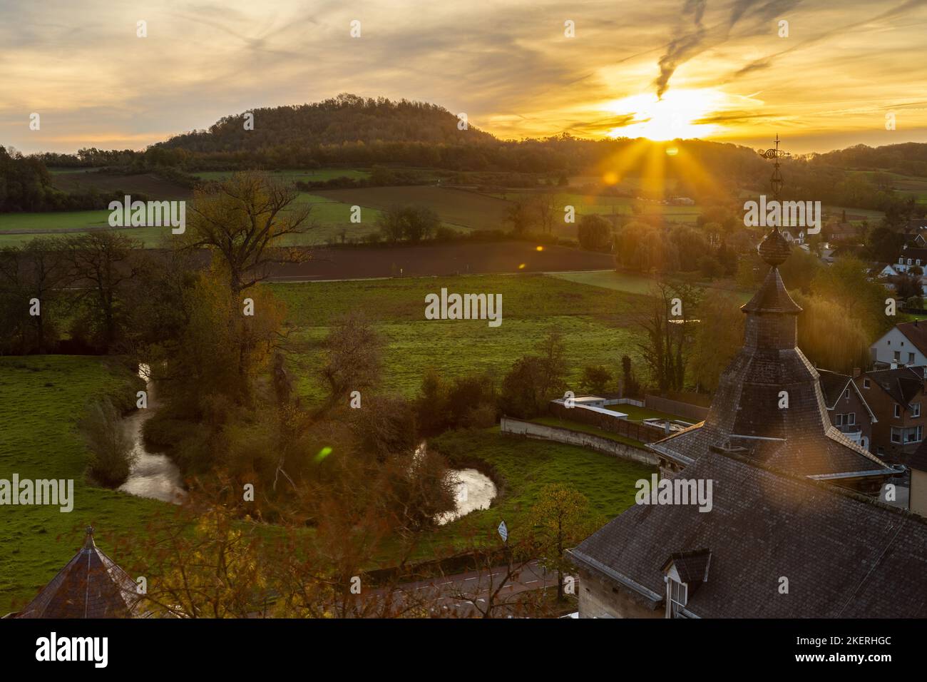 Jeker valley during a spectacular autumn sunrise with amazing sun beams ...