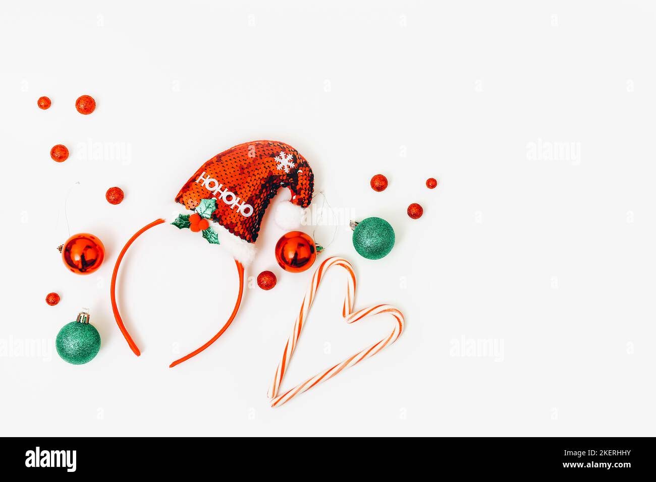 Red Christmas headband with cute red Santa hat and decorations on white ...