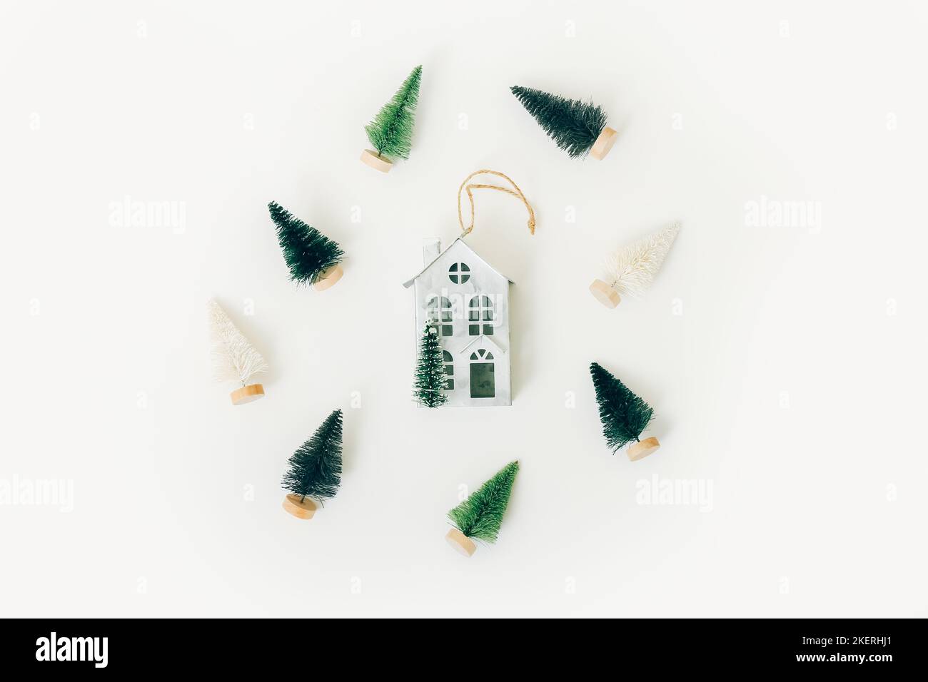 Christmas decorations, holiday concept. Miniature house and fir trees ...
