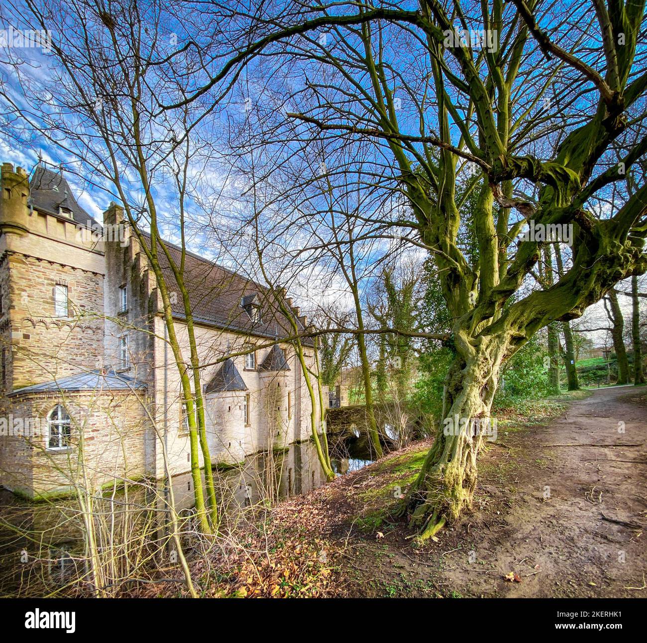 water castle with trees and reflections in water Stock Photo - Alamy