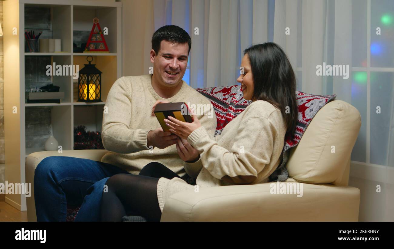 Caucasian man with matching clothes with her girlfriend giving her a ...