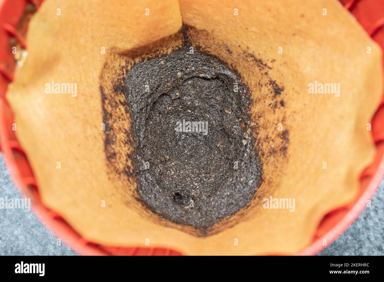 Coffee filter with coffee grounds after preparation Stock Photo - Alamy