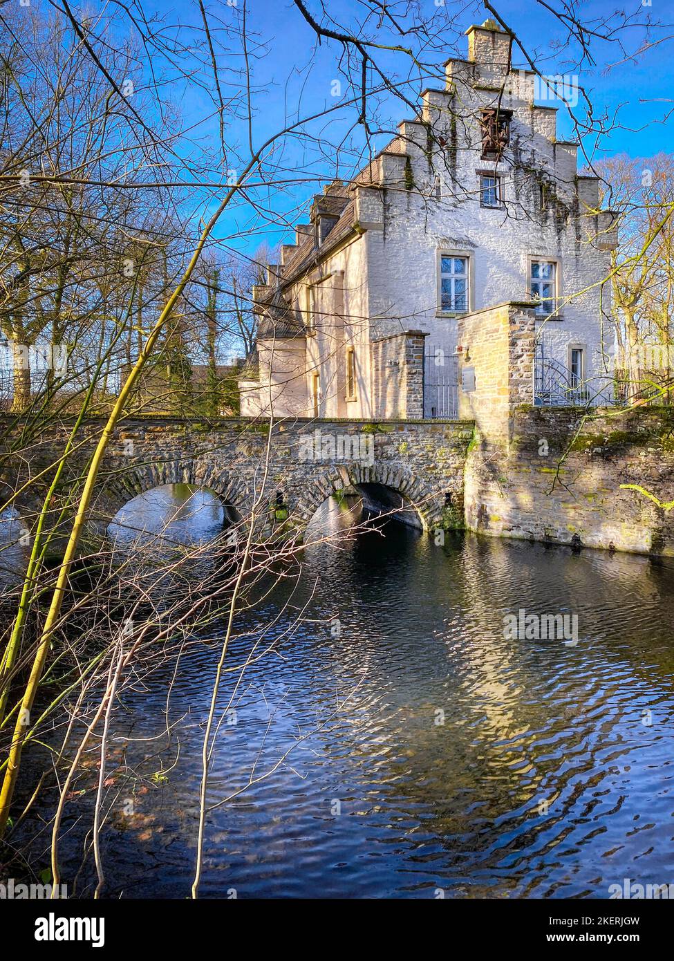 water castle with trees and reflections in water Stock Photo - Alamy