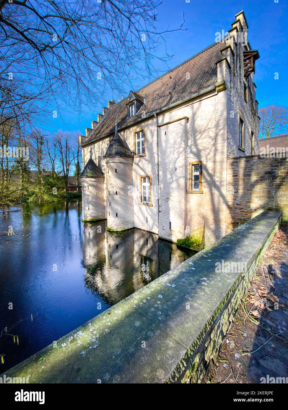 water castle with trees and reflections in water Stock Photo - Alamy