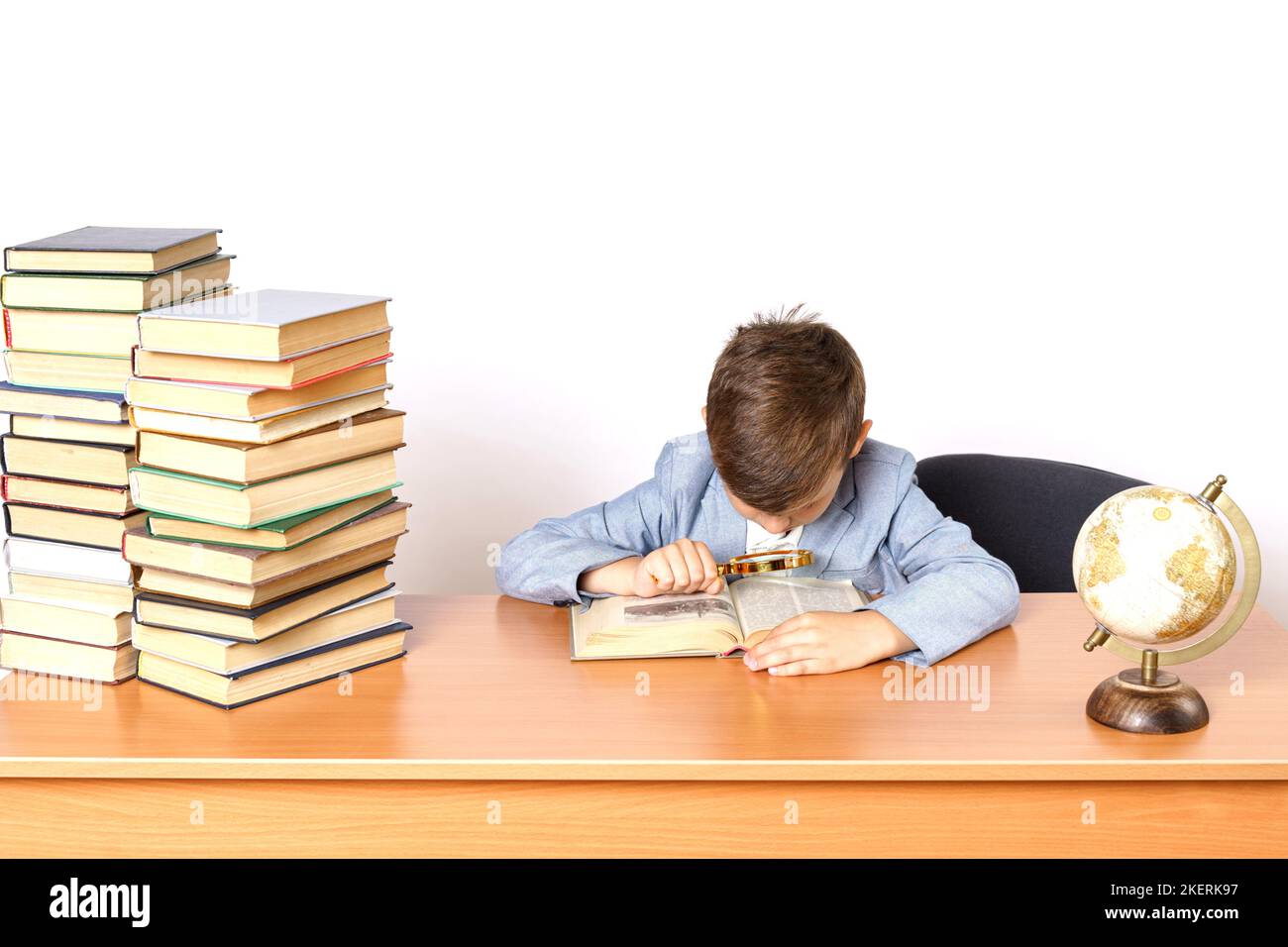 Education concept. The student does homework, reads a book with a ...
