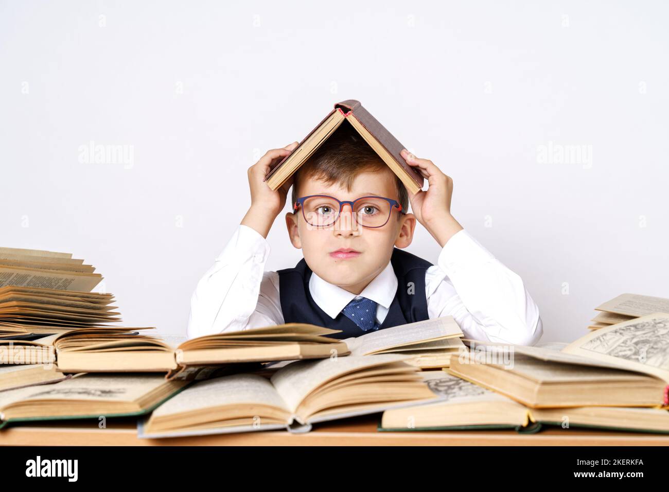 Education concept. The student is doing homework, is tired, put the ...