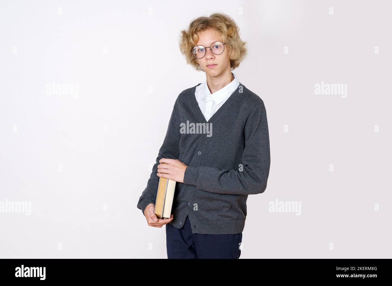 Education concept. Portrait of a teenager boy who is holding books in ...