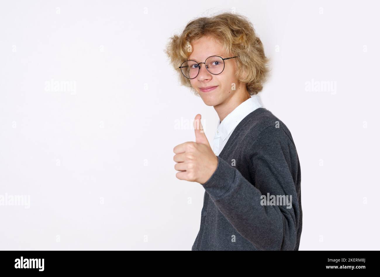 Education concept. Teen boy showing class hand gesture. Isolated over ...