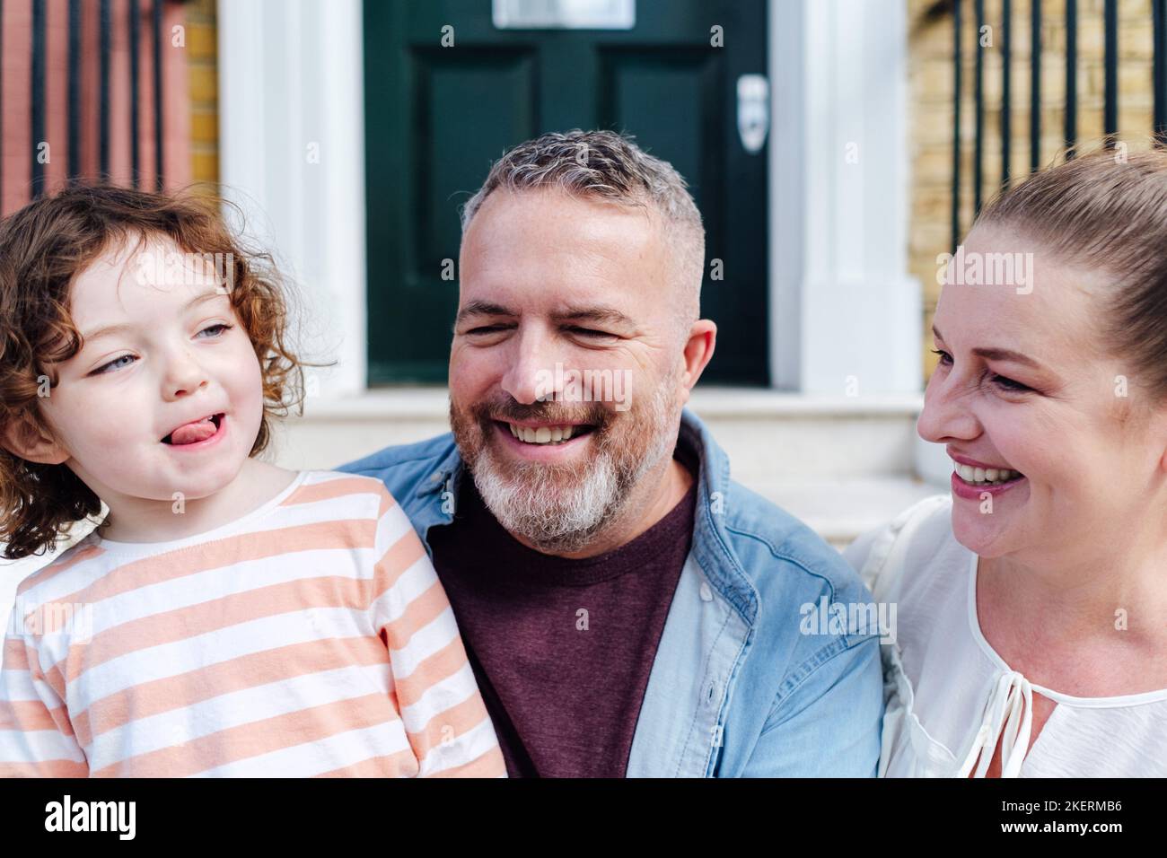 Family sitting on front porch hi-res stock photography and images - Alamy