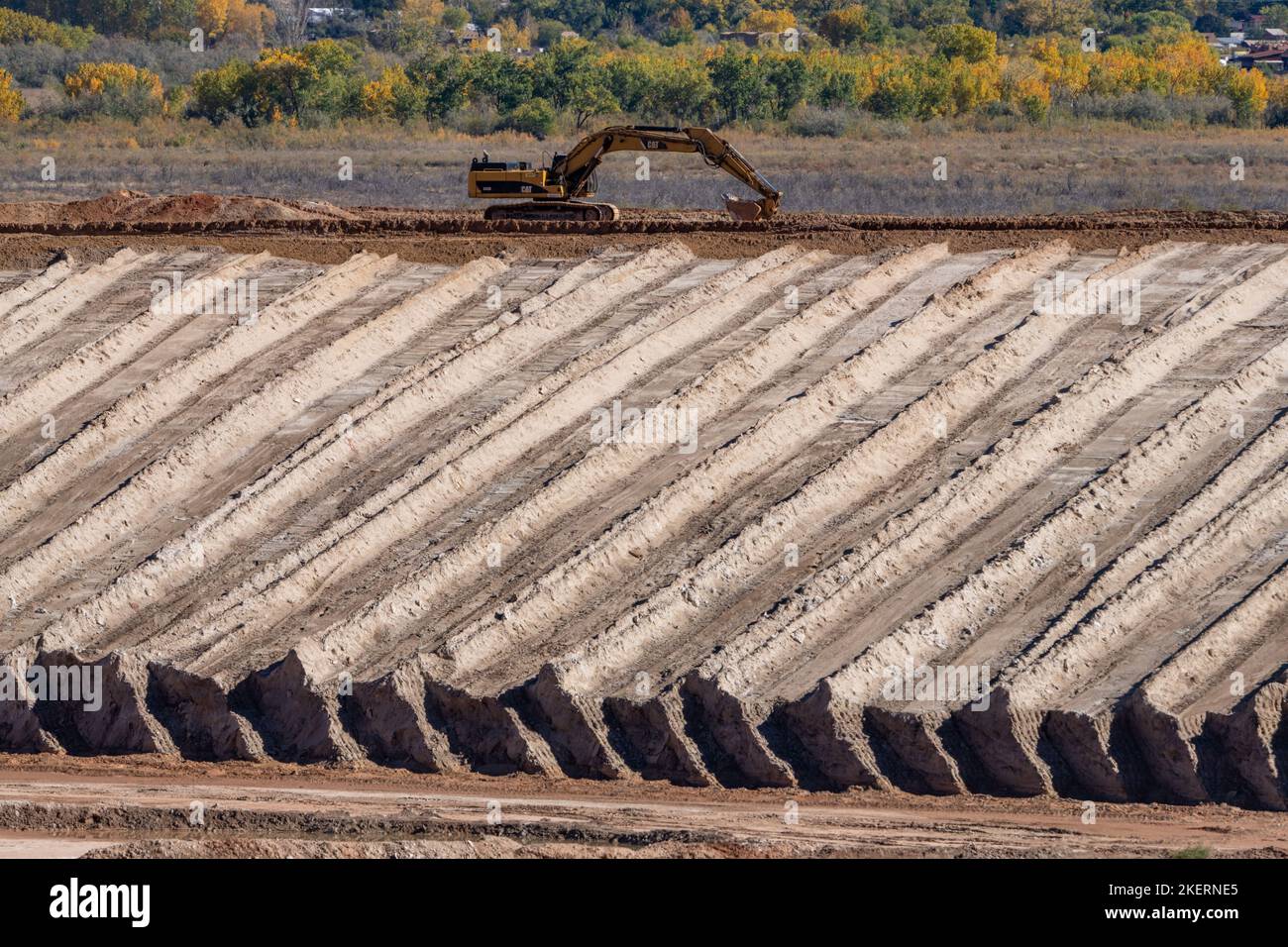 Heavy earth-moving equipment in the uranium tailings pile at the Moab ...