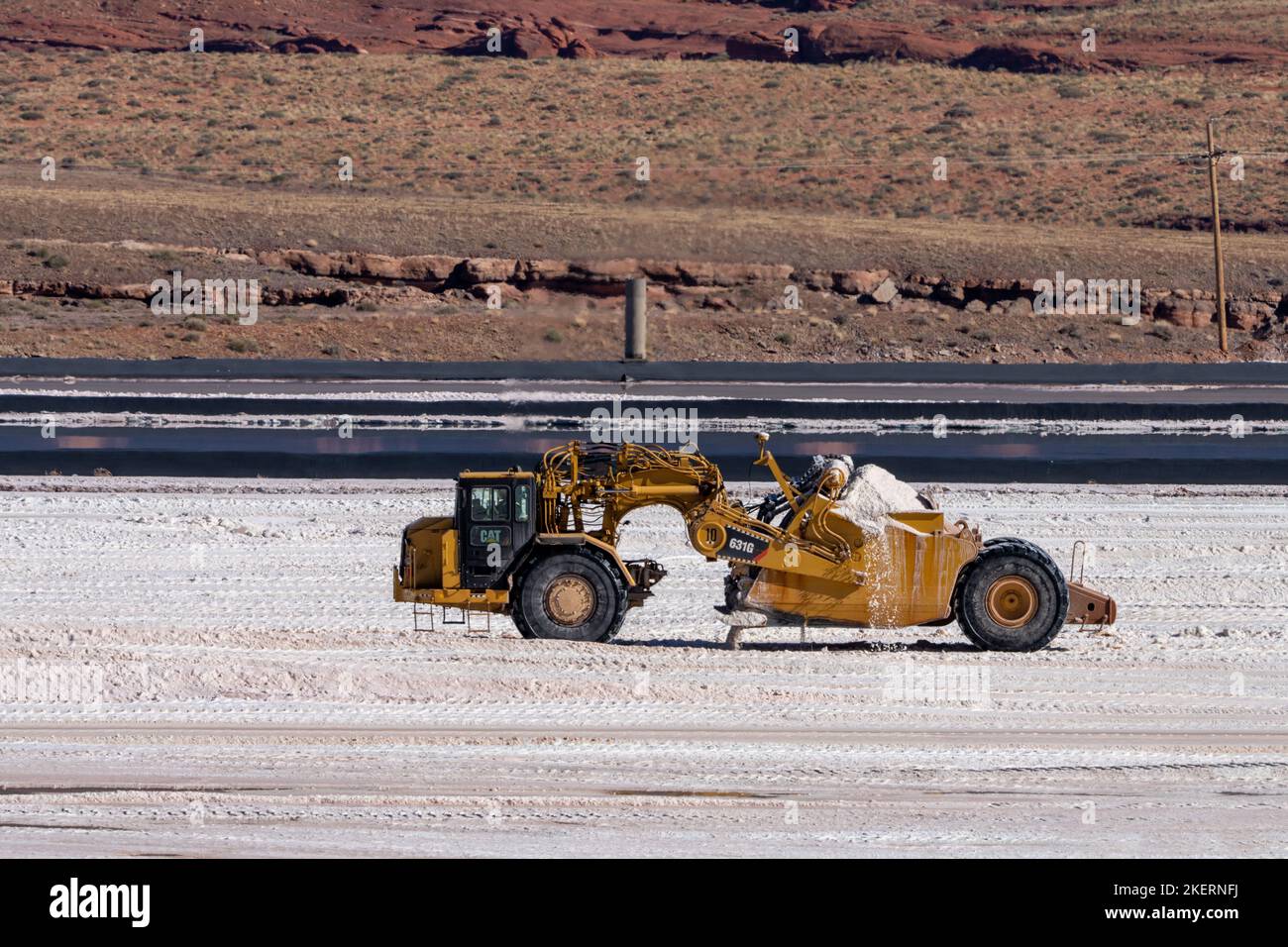 A heavy-duty scraper harvesting potash from an evaporation pond at a ...