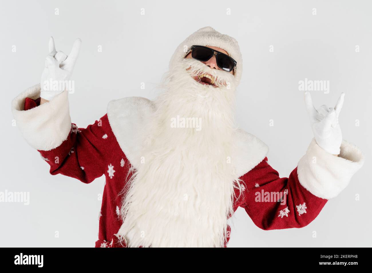 Christmas and New Years concept. Santa Claus shows a gesture by raising ...