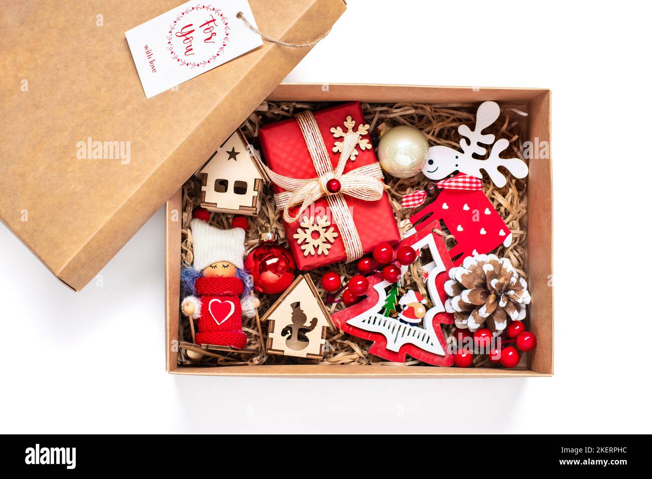 Handmade care package, seasonal gift box with toys, xmas decor on table ...