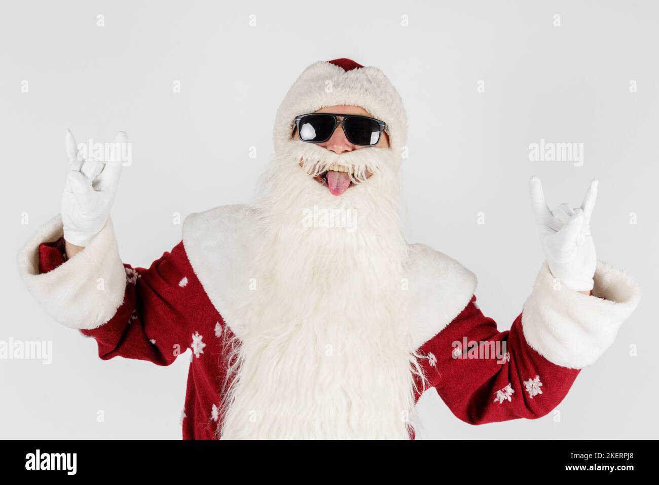 Christmas and New Years concept. Santa Claus shows a gesture by raising ...