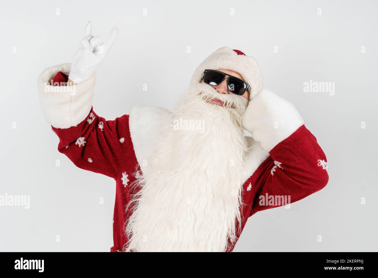 Christmas and New Years concept. Santa Claus shows a gesture by raising ...