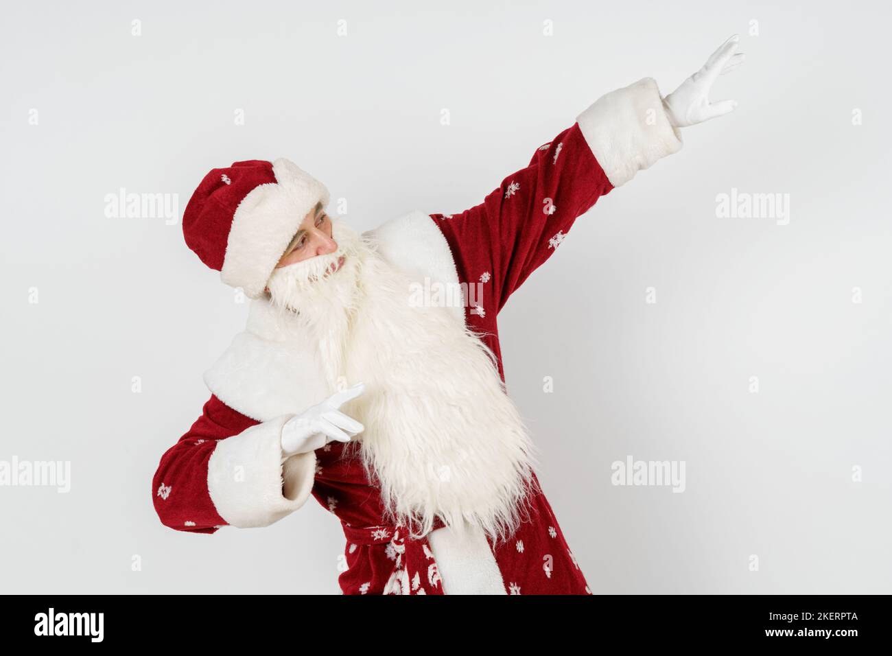 Christmas and New Years concept. Santa Claus shows gesture, raising his ...