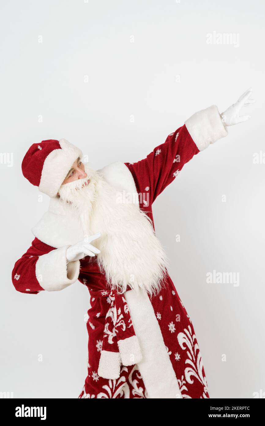 Christmas and New Years concept. Santa Claus shows gesture, raising his ...