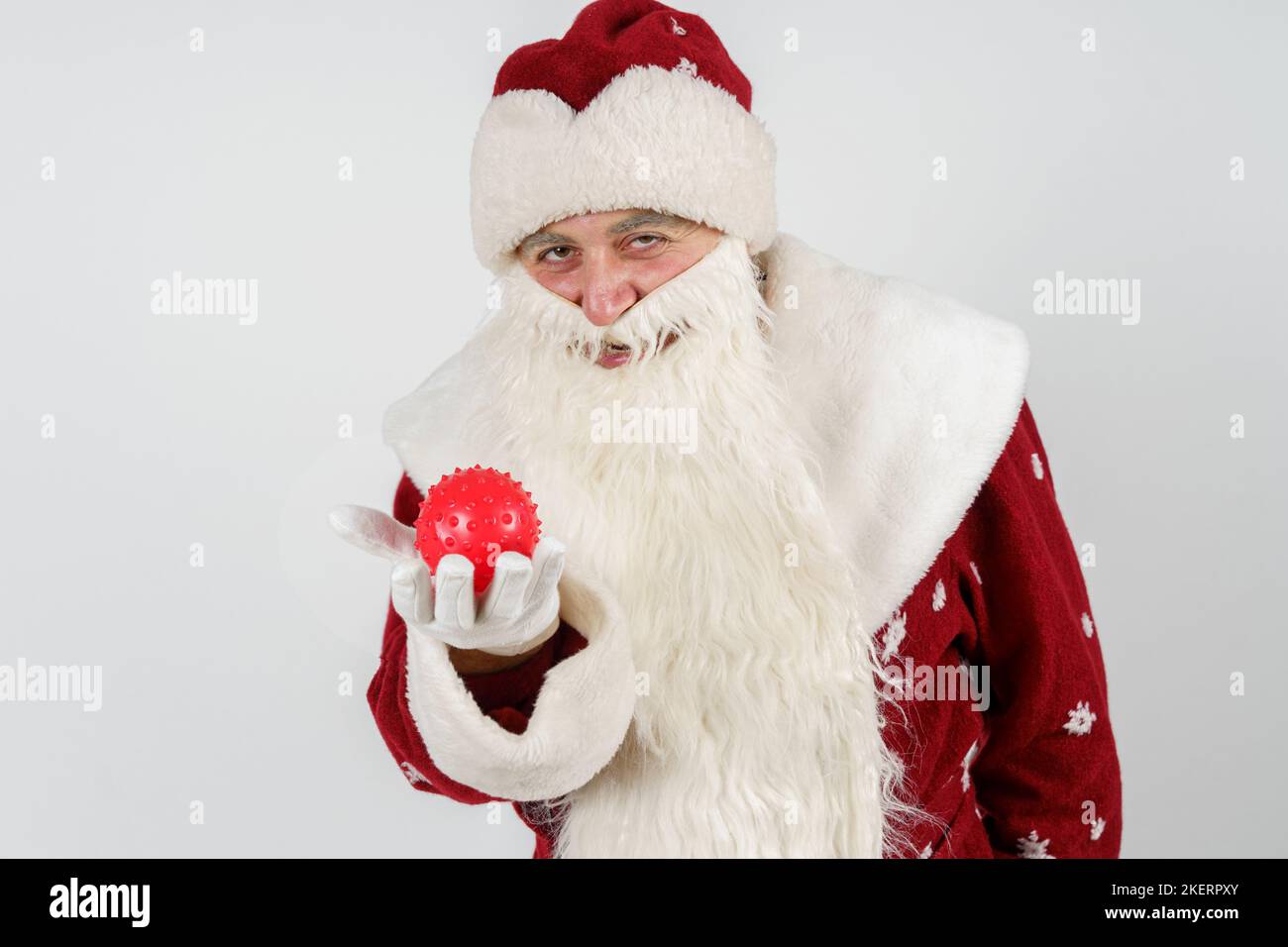 New year and villain concept. Santa Claus holds a virus in his hands ...