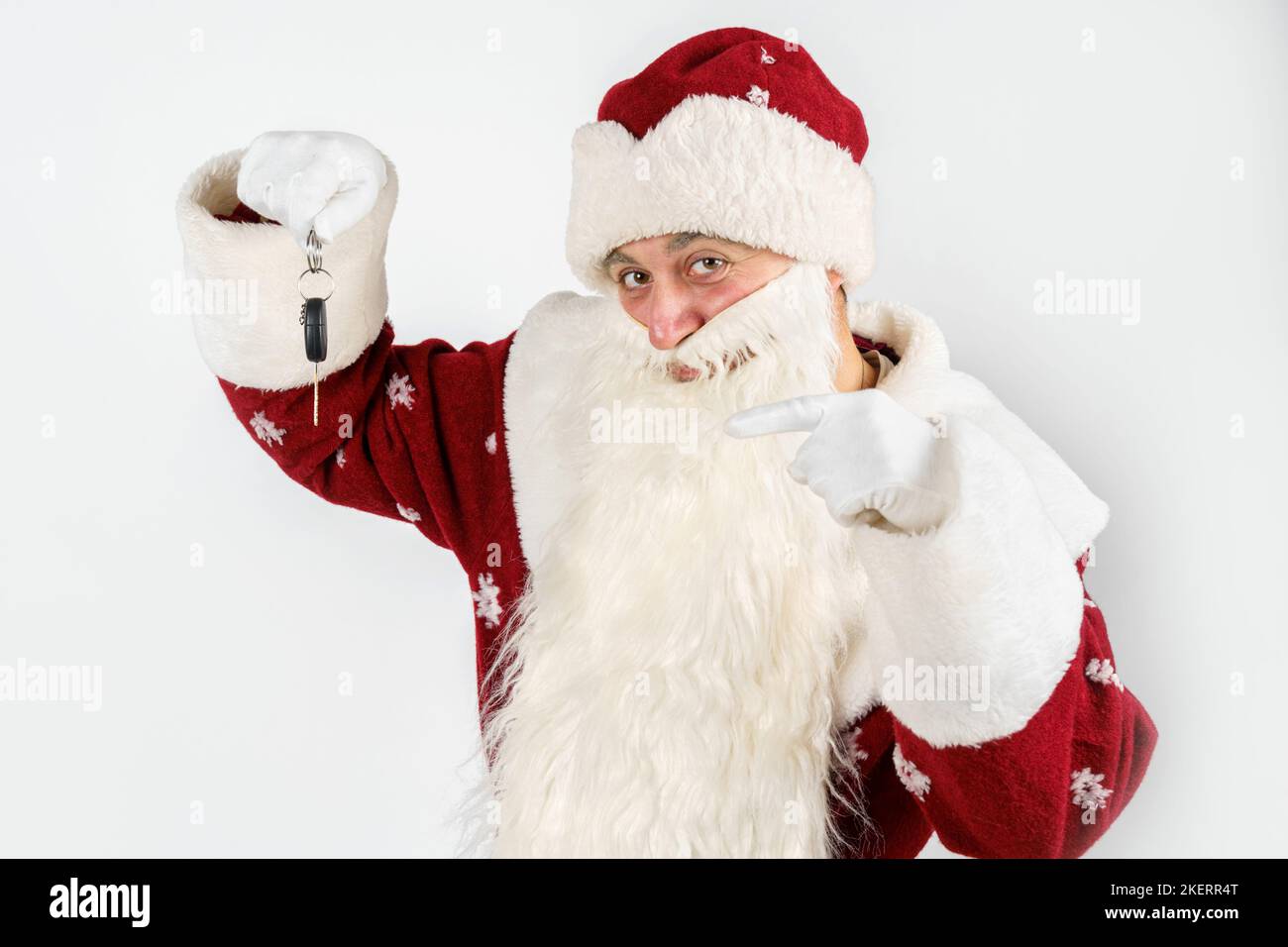 New Year and Christmas concept. Santa Claus is holding a gift - car ...