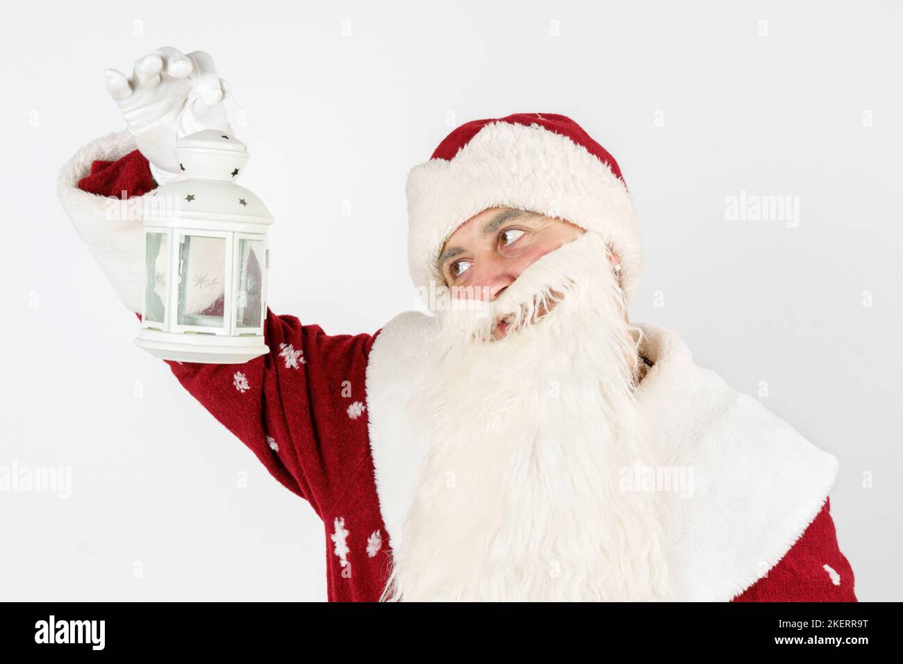 New Year and Christmas concept. Santa Claus holds a flashlight in his ...